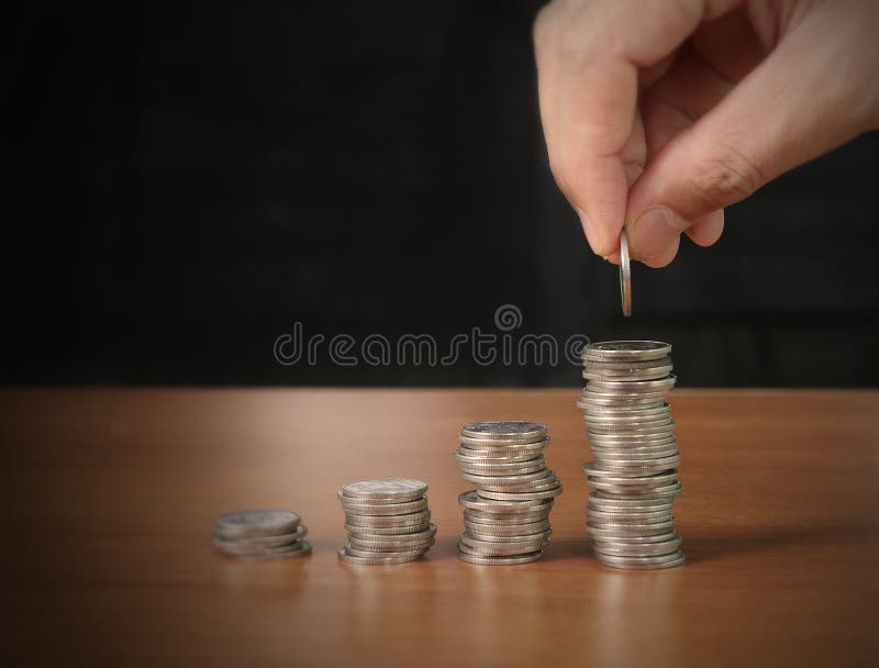 Hand Putting Stack of Coins Stock Photo - Image of gold, closeup: 153961068
