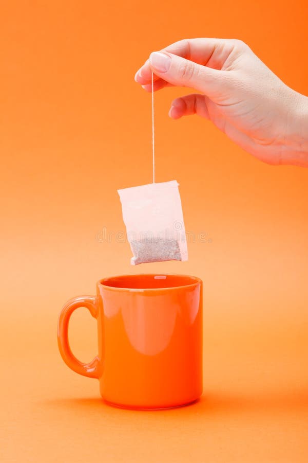 Hand Putting a Tea Bag into Cup Stock Image - Image of hand, herbal ...