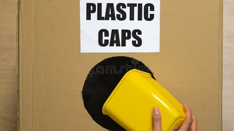 Hand Putting Used Plastic Caps in Waste Container, Sorting Center ...