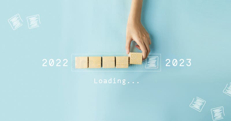 Hand Putting Wooden Cube for Countdown To 2022. Loading Year from 2022 ...