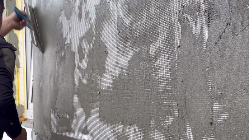 Hand with a Putty Knife, Apply the Putty To the Wall. Process of ...