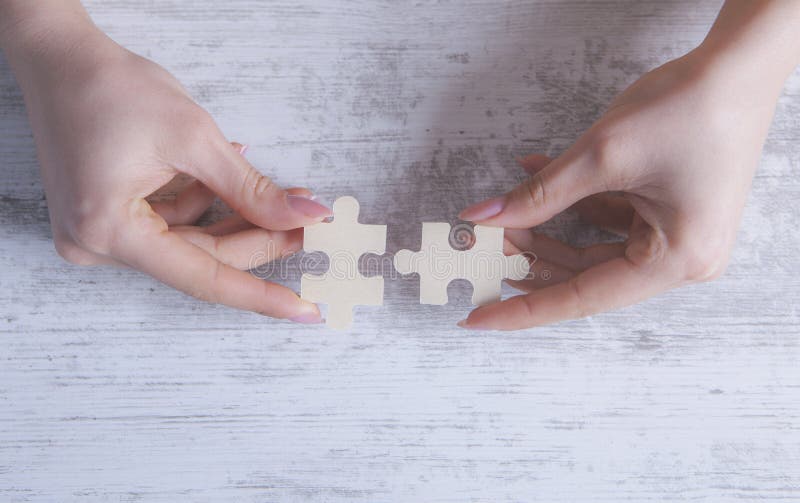 Hand and puzzle stock photo. Image of puzzle, form, coincide - 149065874