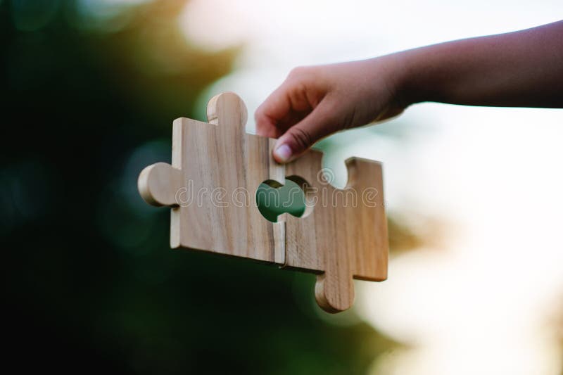 Hand, a Puzzle Piece that is Critical To Success. Creativity, Ideas ...