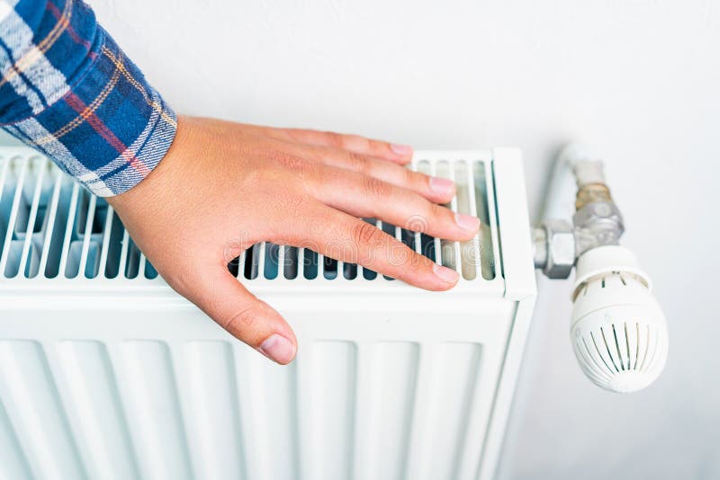 Hand on the Radiator of the Heating System, Selective Focus. Background ...