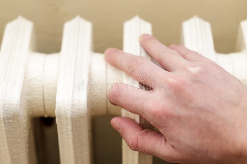 Hand on radiator stock image. Image of cold, home, energy - 67806821