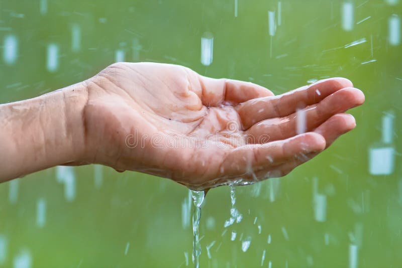 Hand in the rain stock photo. Image of water, female - 43859188