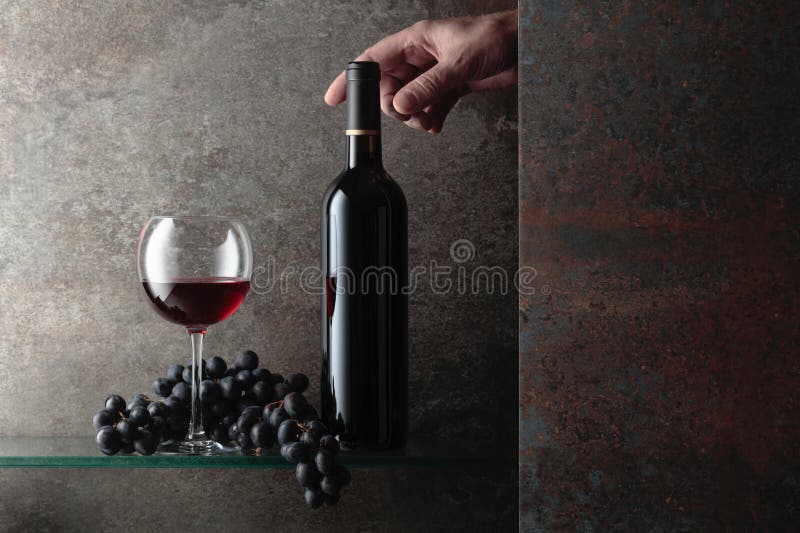 Hand Reaches for a Bottle of Red Wine Stock Photo - Image of design ...