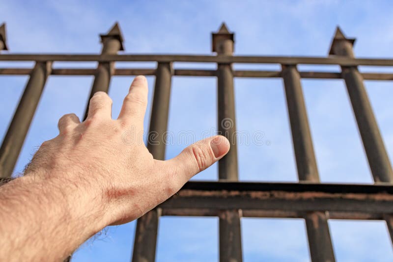 Hand Reaches for the Fence View from the Bottom Point Stock Photo ...