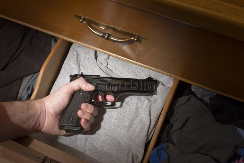 Hand reaching for handgun stock image. Image of violence - 51242123