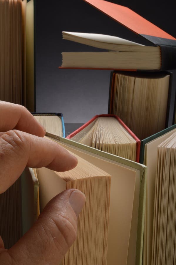 Hand Reaching for Hardbound Book Stock Image - Image of teaching ...
