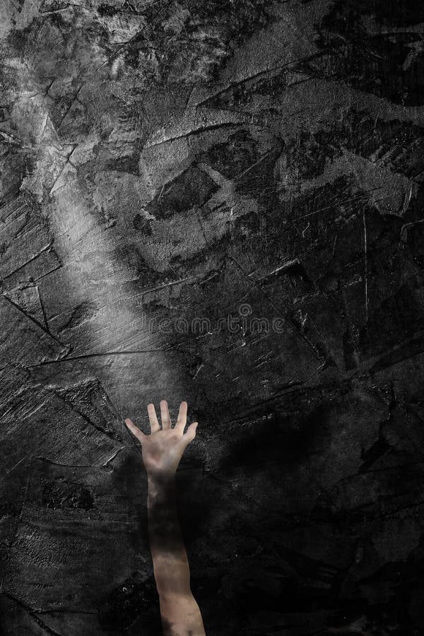 Hand Reaching Out Of Darkness