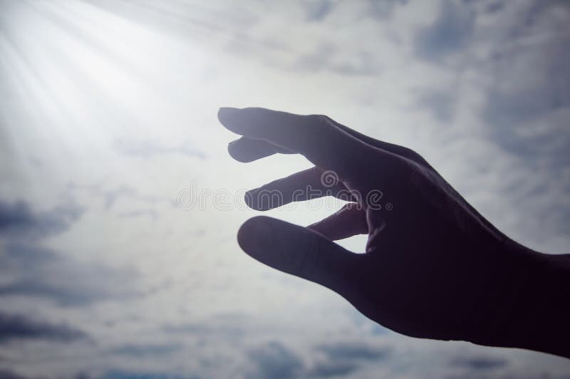 Hand Reaching Out To Light Shining from Heaven. Religious Concept Stock ...