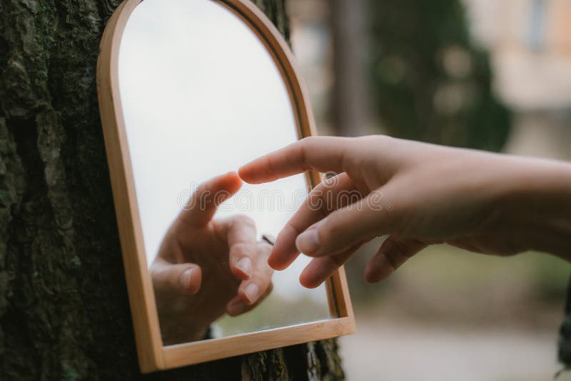 Hand Reaching Mirror Reflection in Nature Setting Stock Photo - Image ...