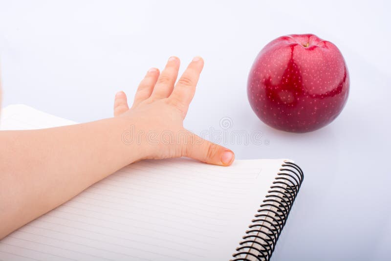 Hand Reaching Red Apple Notebook Stock Photos - Free & Royalty-Free Stock Photos from Dreamstime