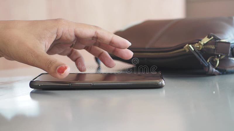 Hand Reaching for a Smart Phone Phone on Table Stock Footage - Video of ...