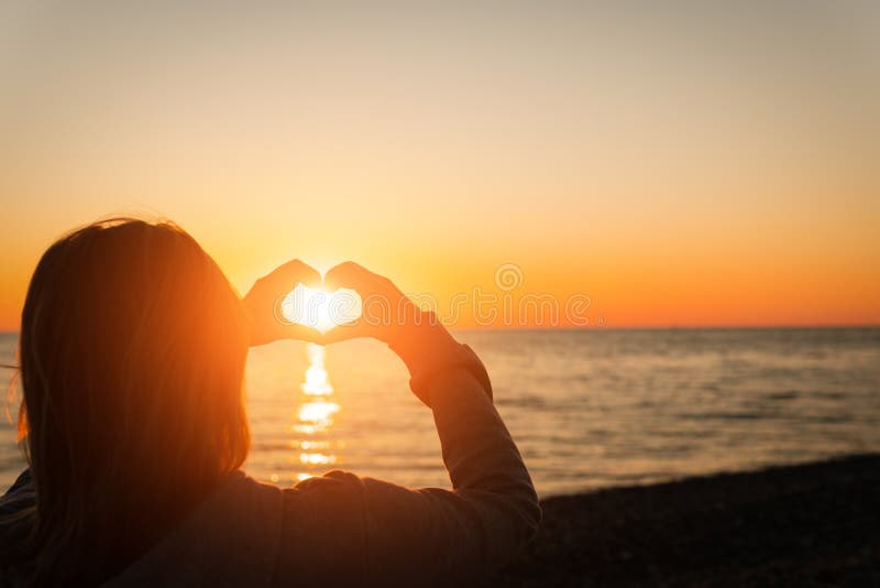Hand Reaching for Sun. Sunset Sun Over the Sea. Stock Photo - Image of ...