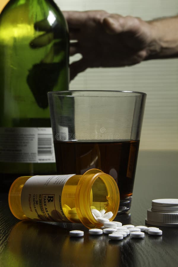 Hand Reaching for Wine and Prescription Pills on Table, Vertical Stock ...
