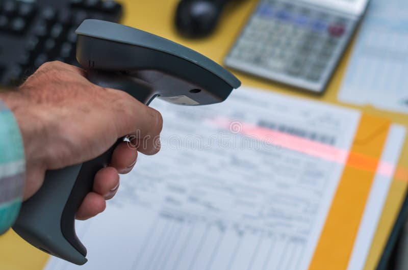 Hand Reading the Invoice Barcode, Stored Data in the System, Making ...