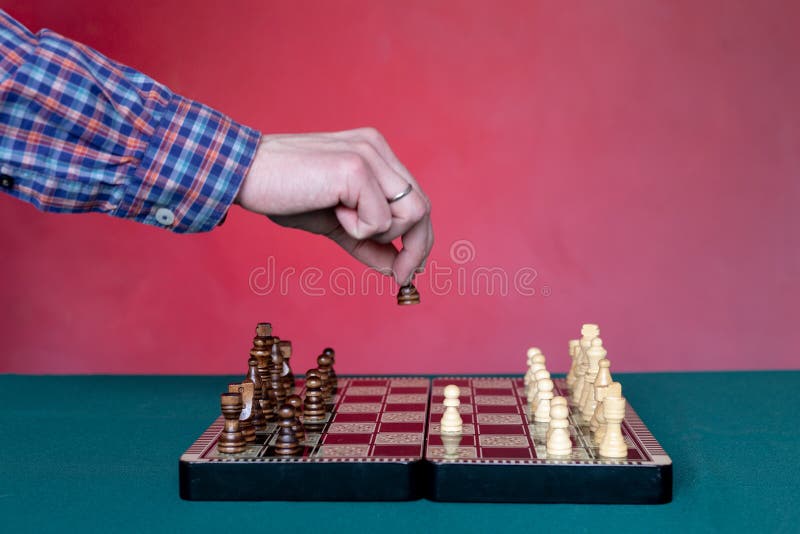 Hand Rearranging a Chess Piece. Classic Game Stock Image - Image of ...