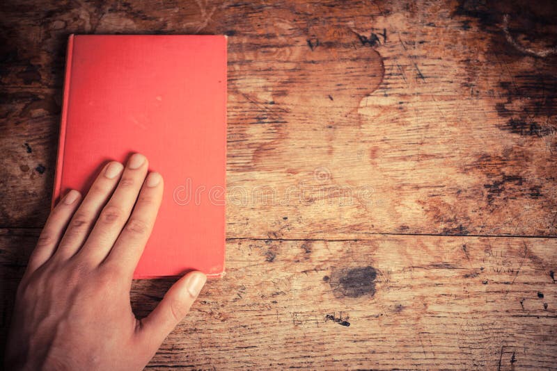 Hand on red book stock photo. Image of tint, people, filtered - 38560546