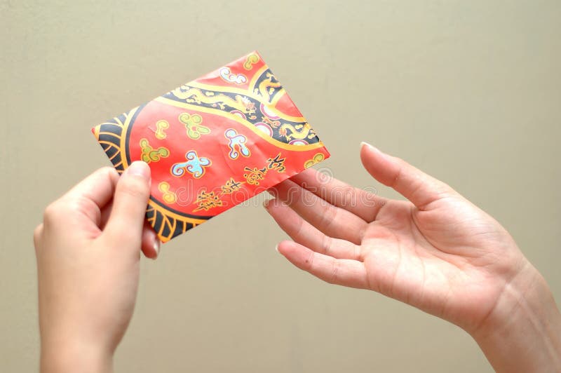 Hand with red packet stock image. Image of packet, offer - 361309