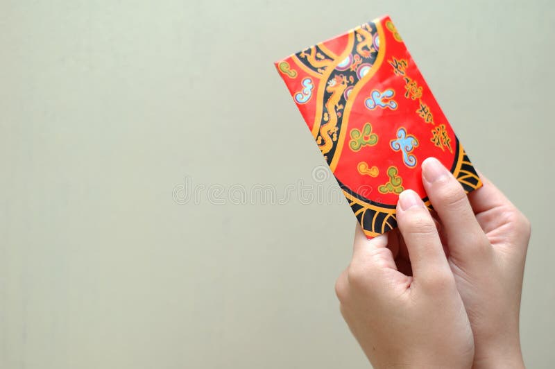 Hand with red packet stock image. Image of paperwork, hands - 361311