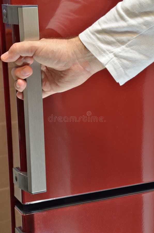 Hand on Red Refrigerator Handle Stock Photo - Image of food, home: 61556816