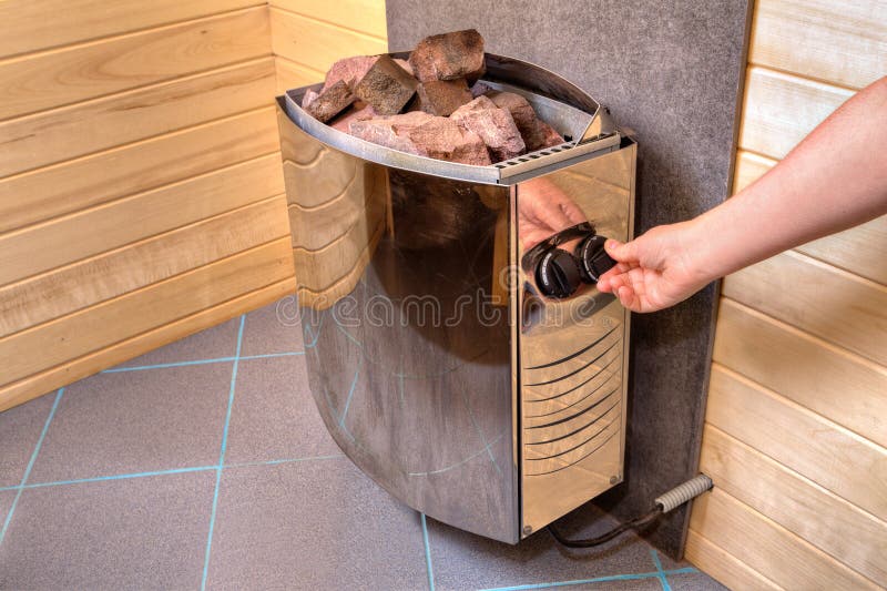 Hand Regulates Control Panel the Electric Stove Heater in Sauna Stock ...