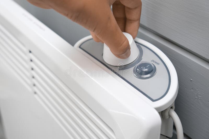 Hand Regulating, Setting Temperature on Electric Con, Heater ...