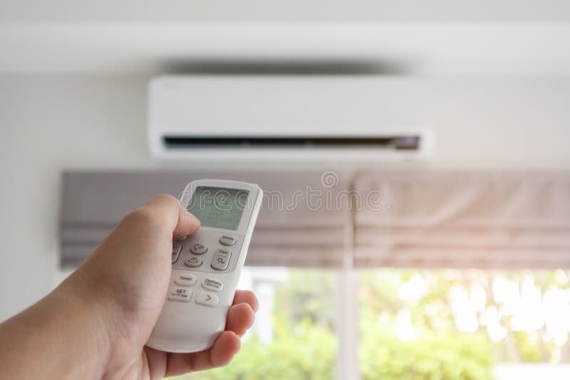 Hand with Remote Control Directed on Air Conditioner Stock Image ...