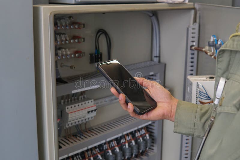 Hand with Remote Panel of Electric Room. Stock Image - Image of control ...
