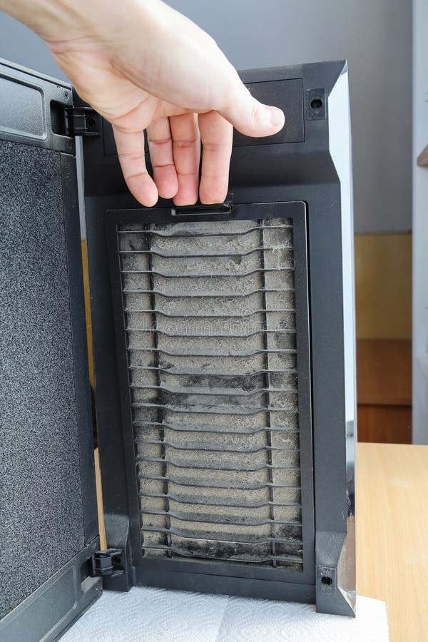 Hand Removes Filter of Cooling System in Computer is Filled with Dust ...