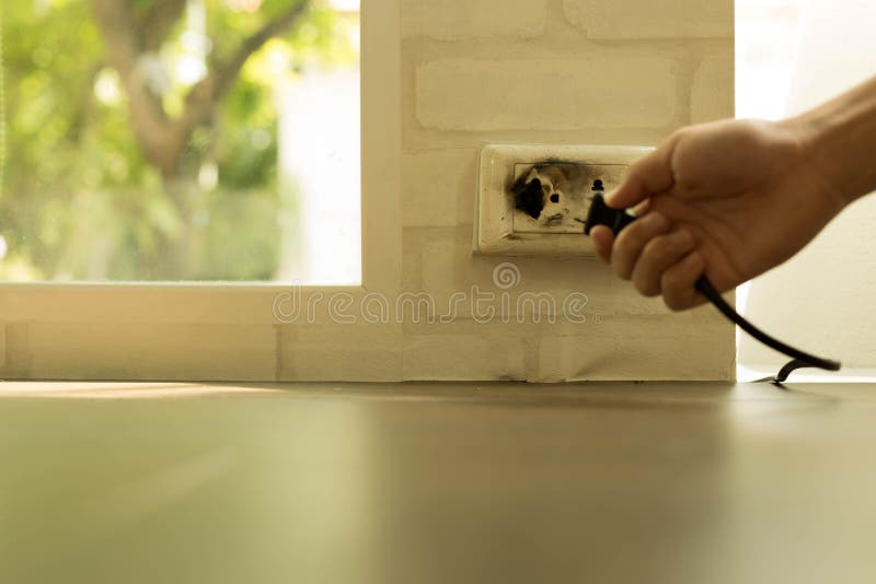 Hand Removing Plug From Outlet Stock Photo - Image of green, connect ...