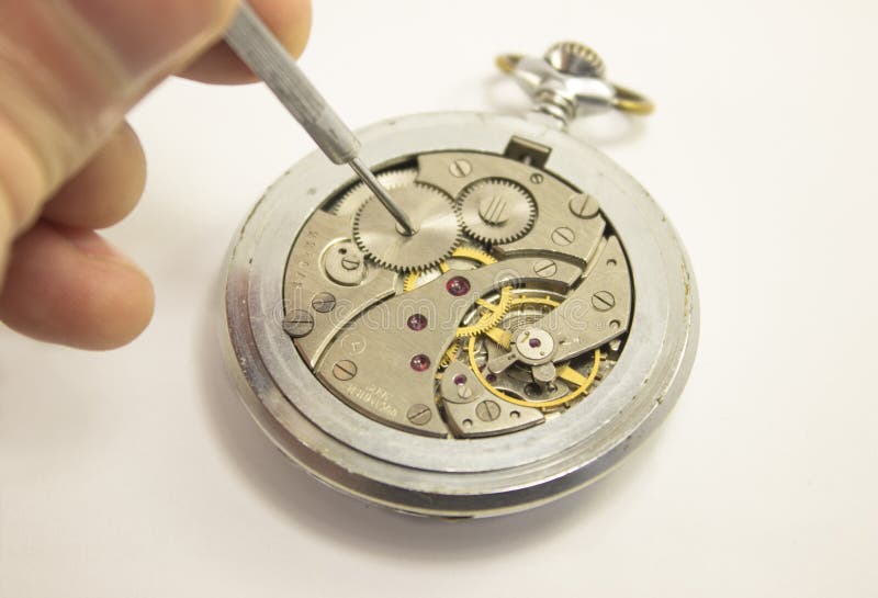 Hand Repairs Mechanical Watch. Isolated Stock Photo - Image of hand ...