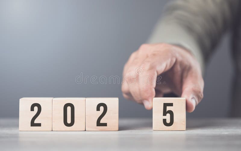 Hand Replaces 2024 with 2025 Using Number Blocks, Symbolizing the ...