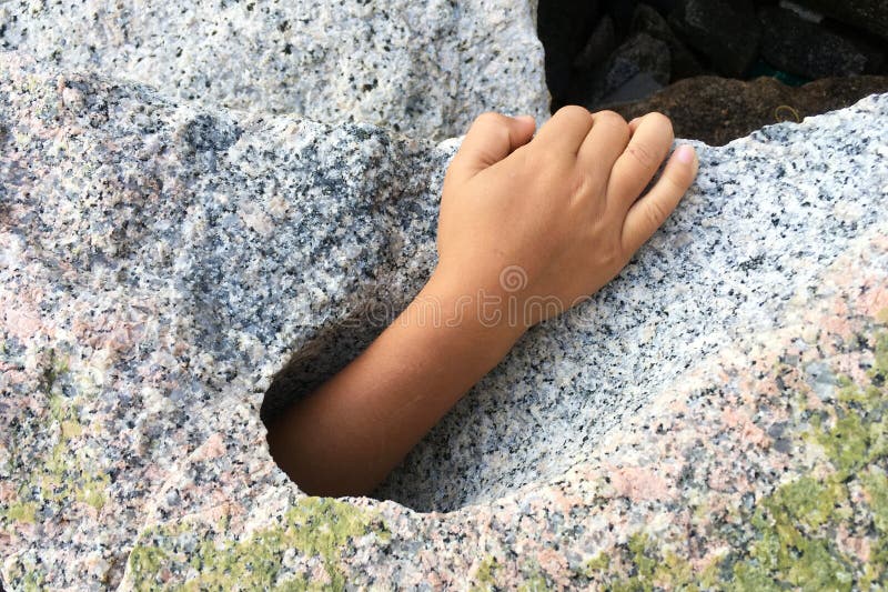 Hand Request Help from Big Stone Hole Stock Photo - Image of save ...
