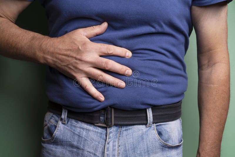 Hand Resting on His Stomach Stock Photo - Image of health, jeans: 254796338