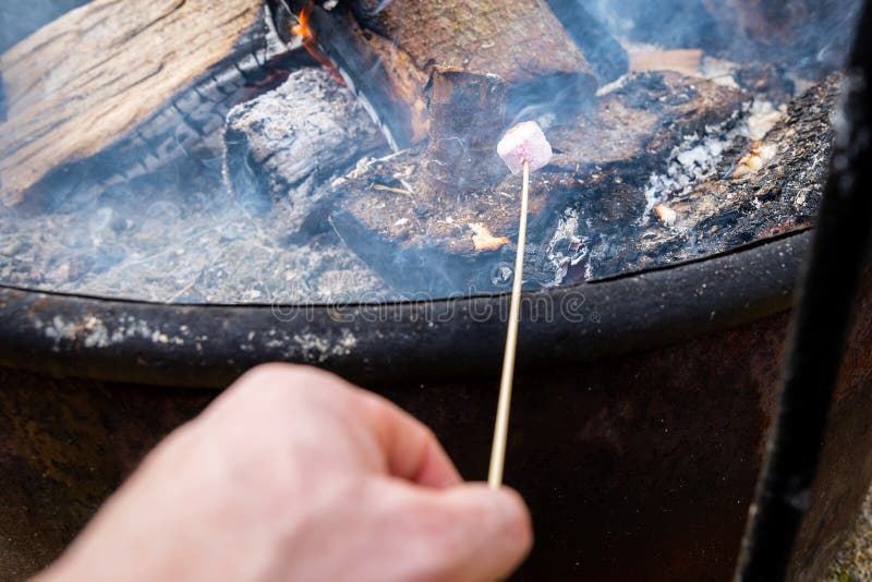 A Hand Roasting a Marshmellow Stock Photo - Image of indulgence ...