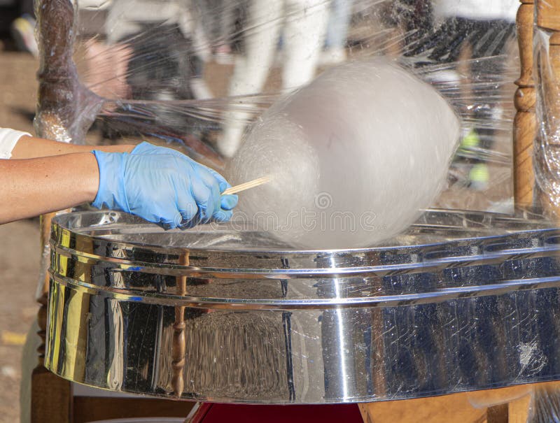 Hand Rolled Cotton Candy into Candy Thread Machine. Candy Making Stock ...