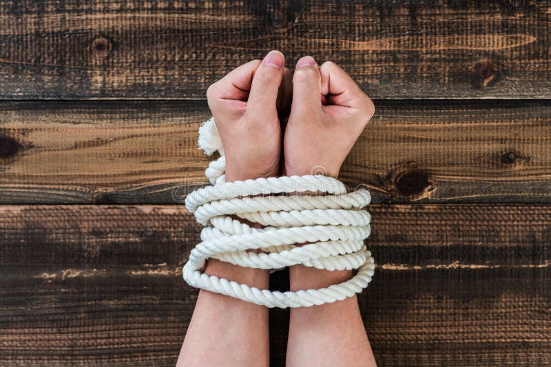 Hand with the rope tied up stock image. Image of risk - 94647287