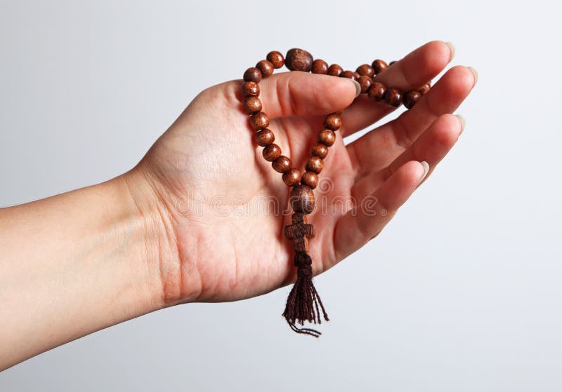 A hand and rosary stock photo. Image of bidding, religious - 22398684