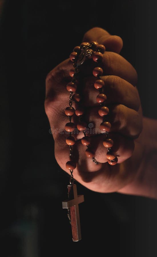Hand with rosary stock image. Image of prayer, holding - 255563765