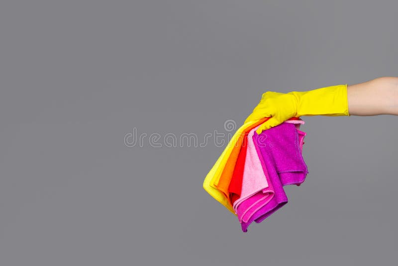 A Hand in a Rubber Glove Holds a Set of Colored Microfiber Cloths on a ...