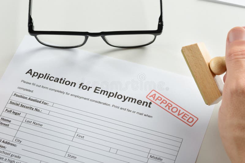 Hand with Rubber Stamp and Approved Employment Application Stock Photo ...