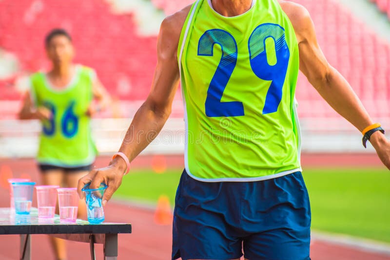 Hand of the Runner Grabbing the Water Stock Photo - Image of ...