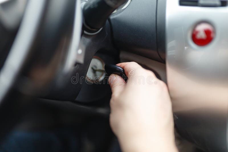 Hand S Man Plug in a Key Starting the Engine of a Car. the Hand Stock ...