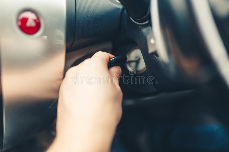 Hand S Man Plug in a Key Starting the Engine of a Car. Stock Image ...