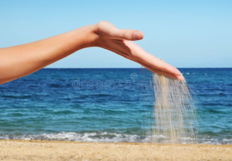 Woman with sand in hands stock image. Image of close - 20727719