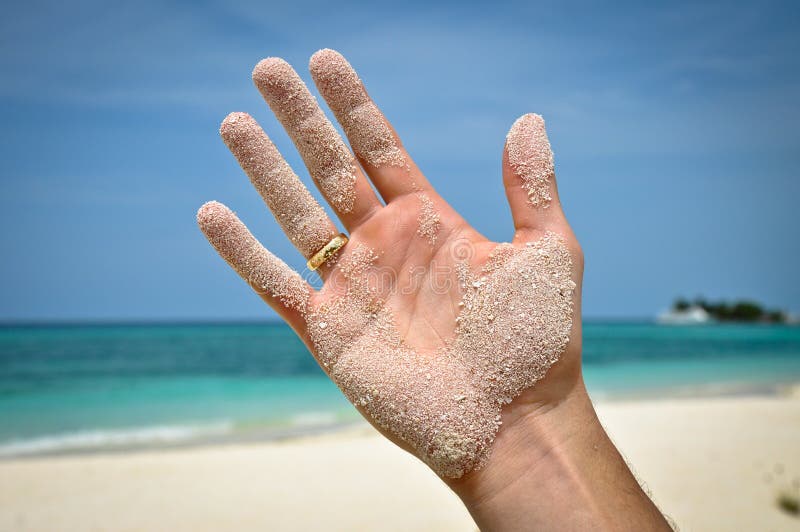 Hand with sand stock photo. Image of water, summer, showing - 25778498