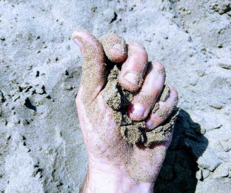 Hand with sand stock photo. Image of texture, fingers - 111997008